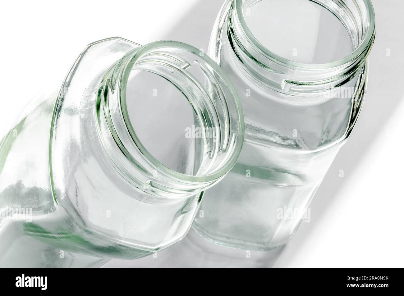 Transparent glass jars on white, with high-key effect Stock Photo - Alamy