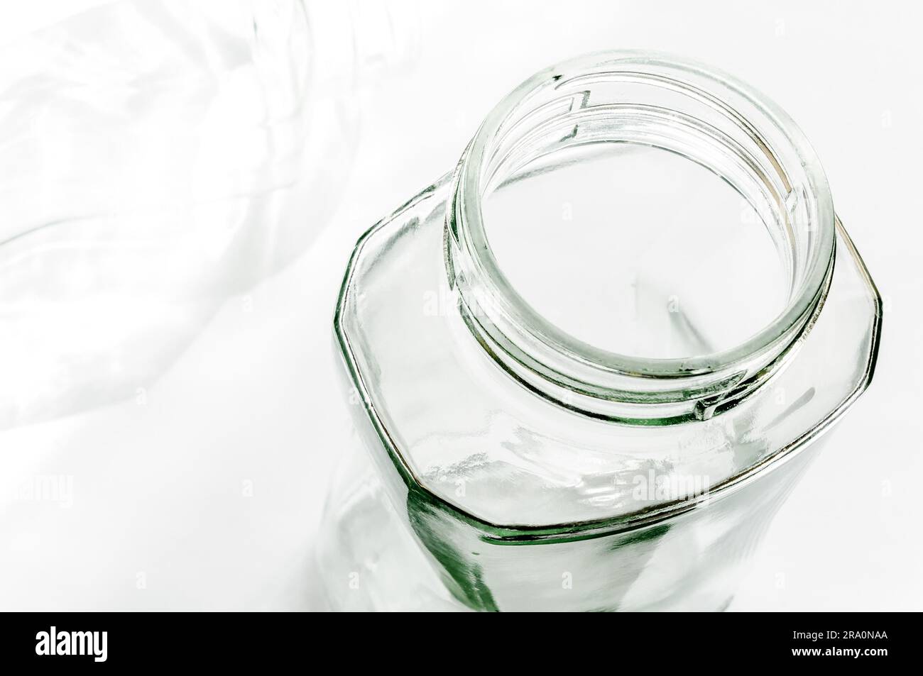 Transparent glass jars on white, with high-key effect Stock Photo - Alamy