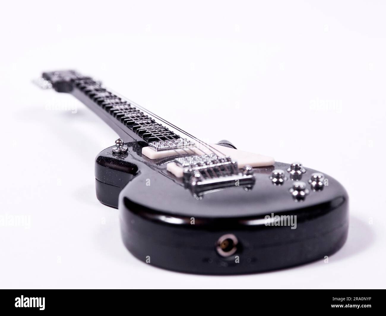 A small lighter guitar Stock Photo - Alamy