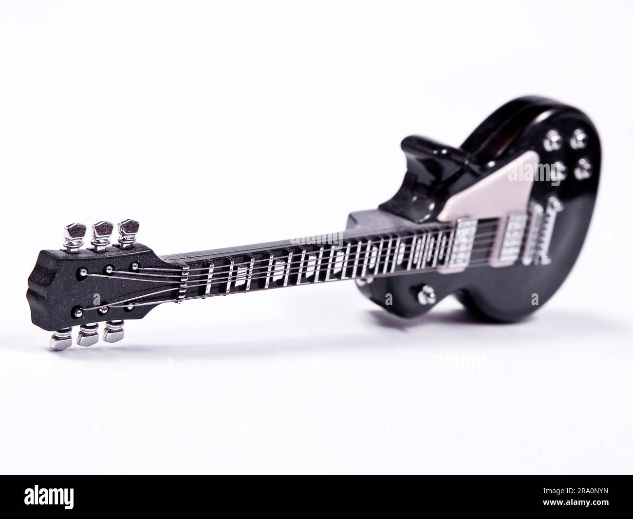 A small lighter guitar Stock Photo - Alamy