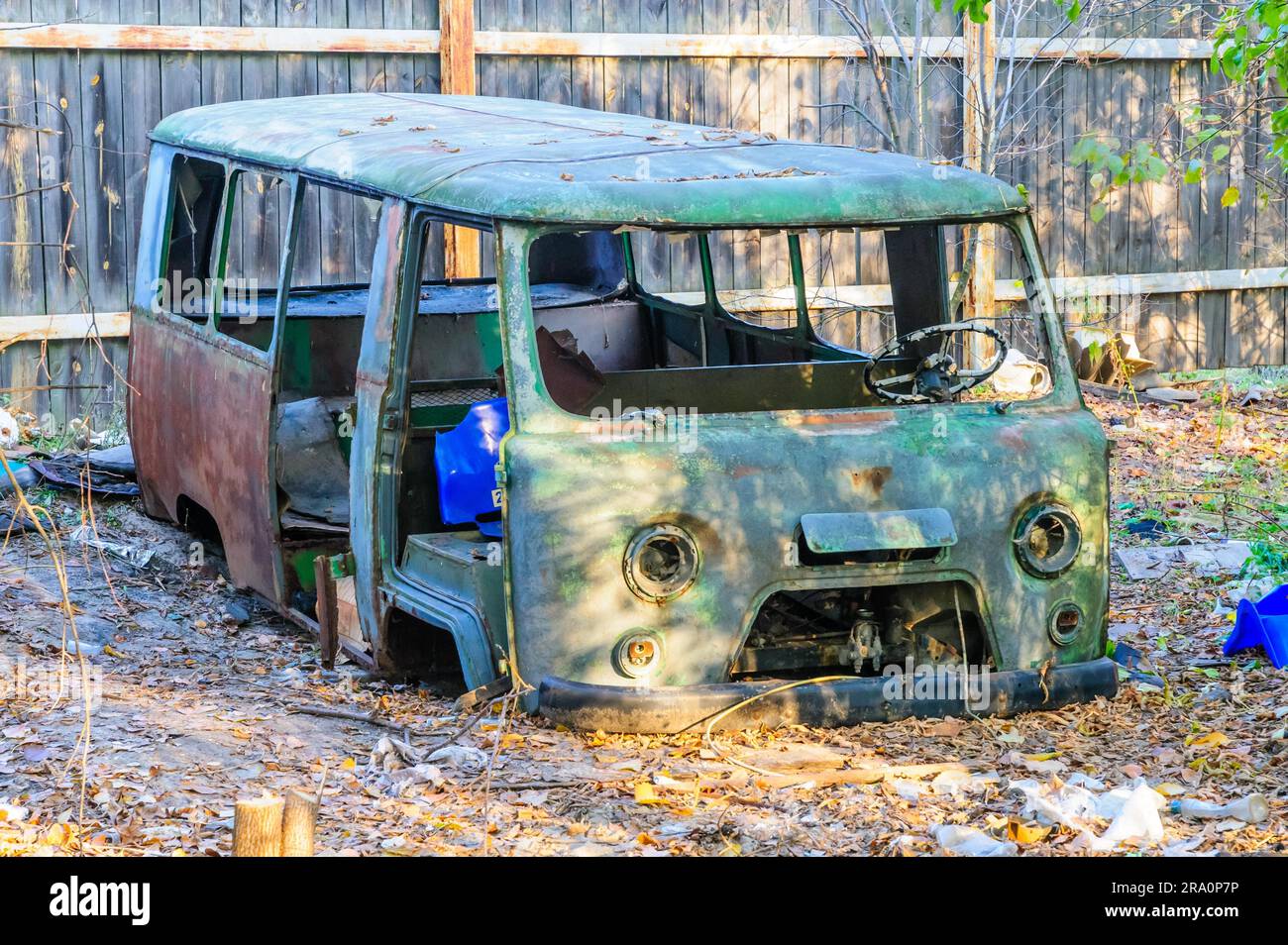 An old and rust abandoned mini van Stock Photo - Alamy