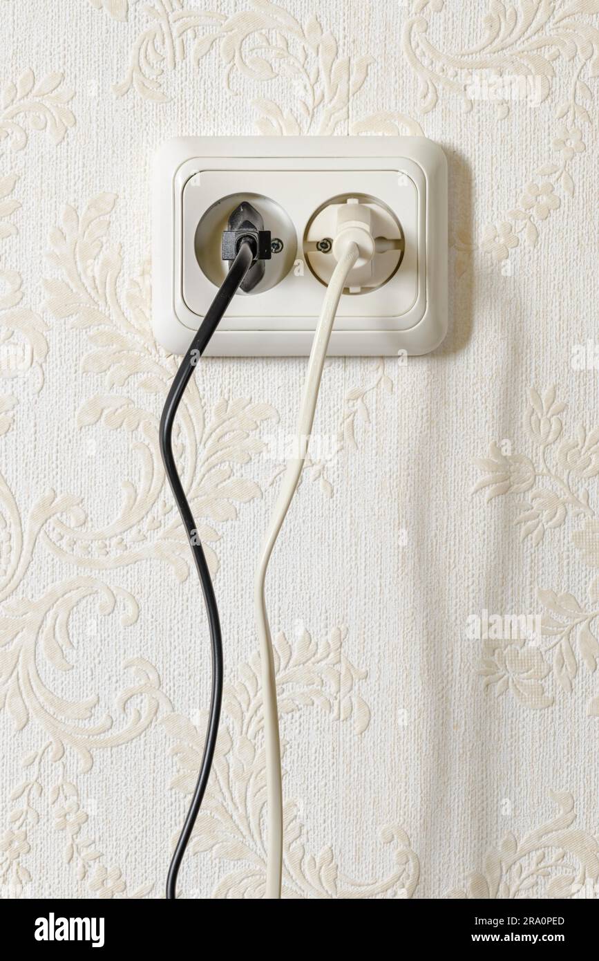 Two european plugs in the wall Stock Photo - Alamy