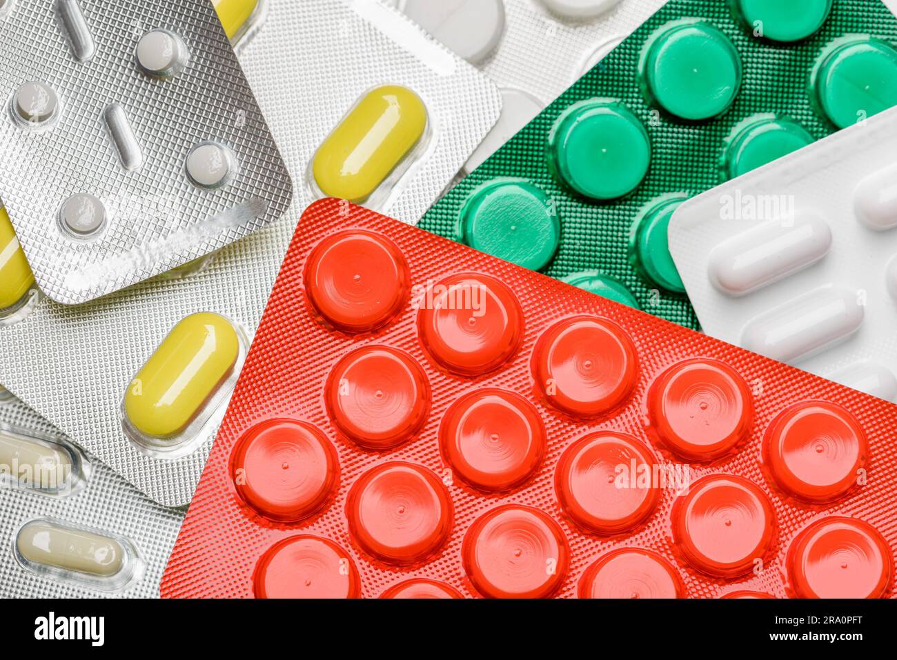 Red, yellow, green and white pills blisters of pharmacy to cure pain ...