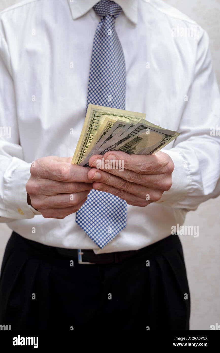 Businessman counting money work hi-res stock photography and images - Alamy