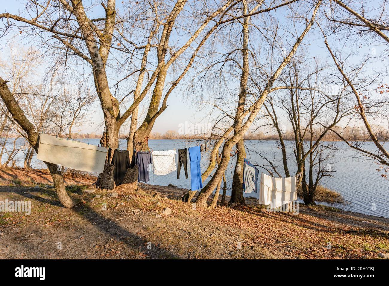 Laundry drying on a wire, under the mild winter sun, near the Dnieper ...