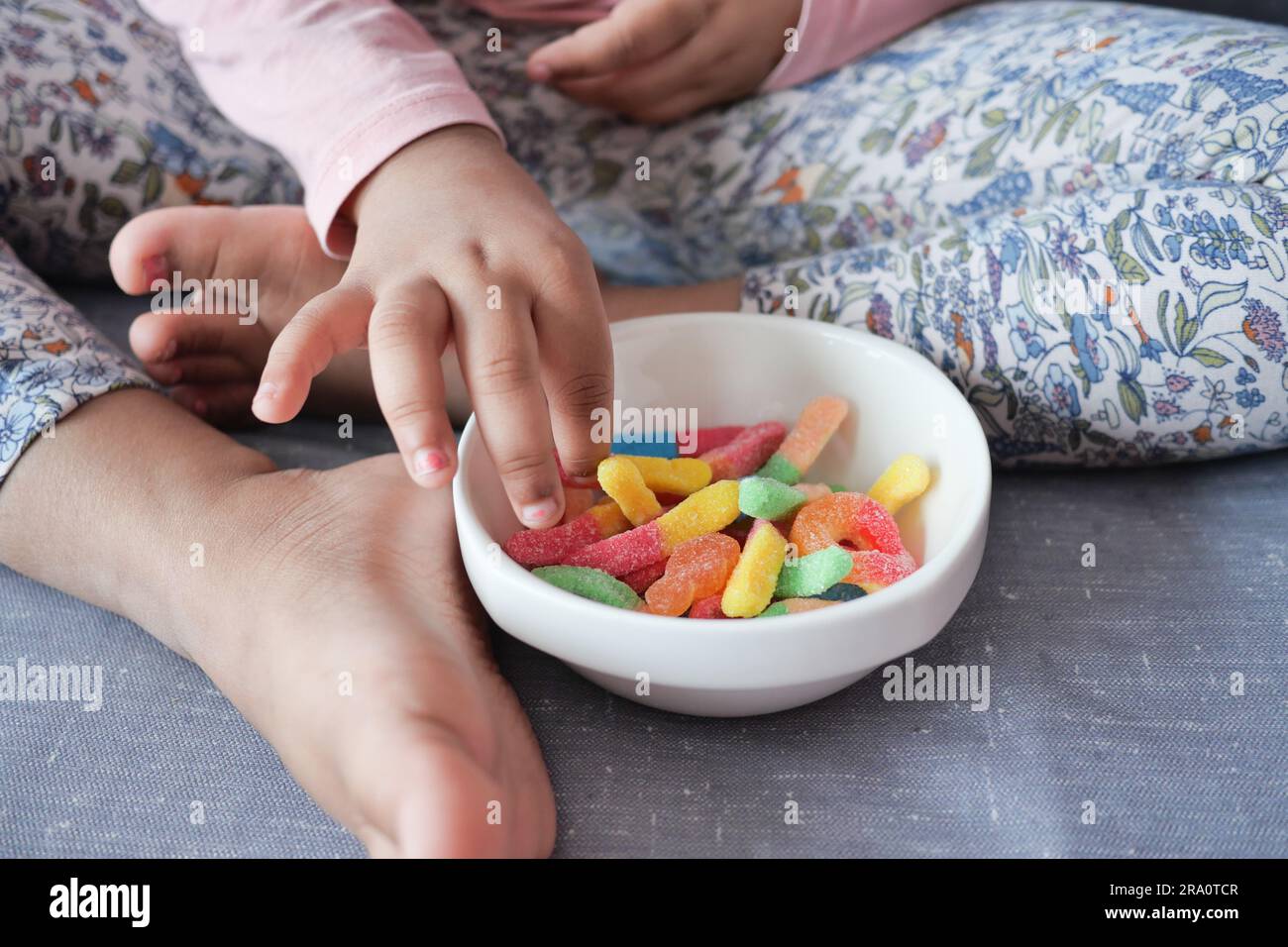 child hand pick jelly sweet candy Stock Photo - Alamy