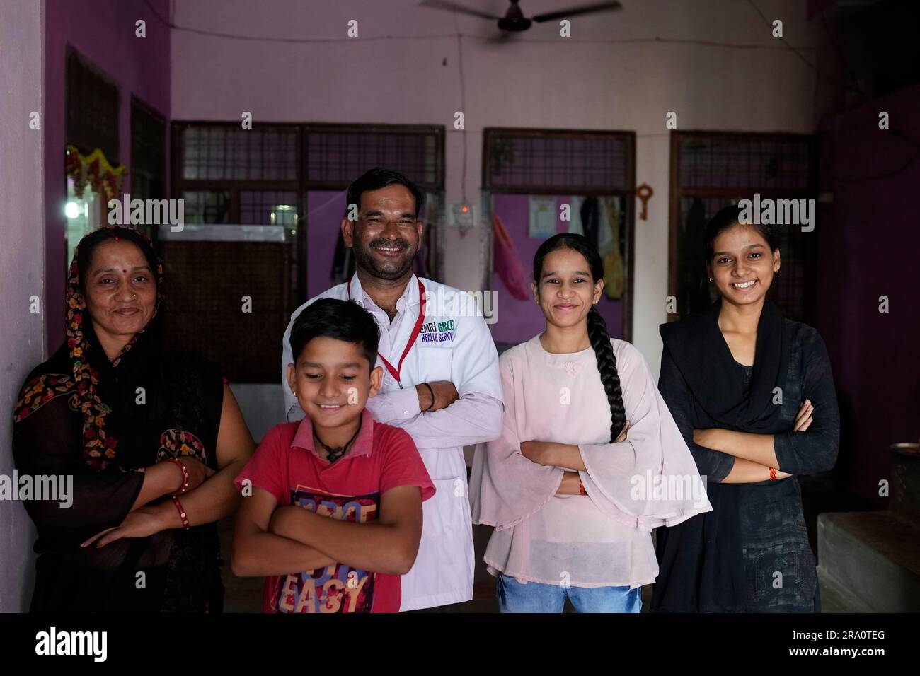 Sunil Kumar Naik, an ambulance driver, poses for a photograph with his ...