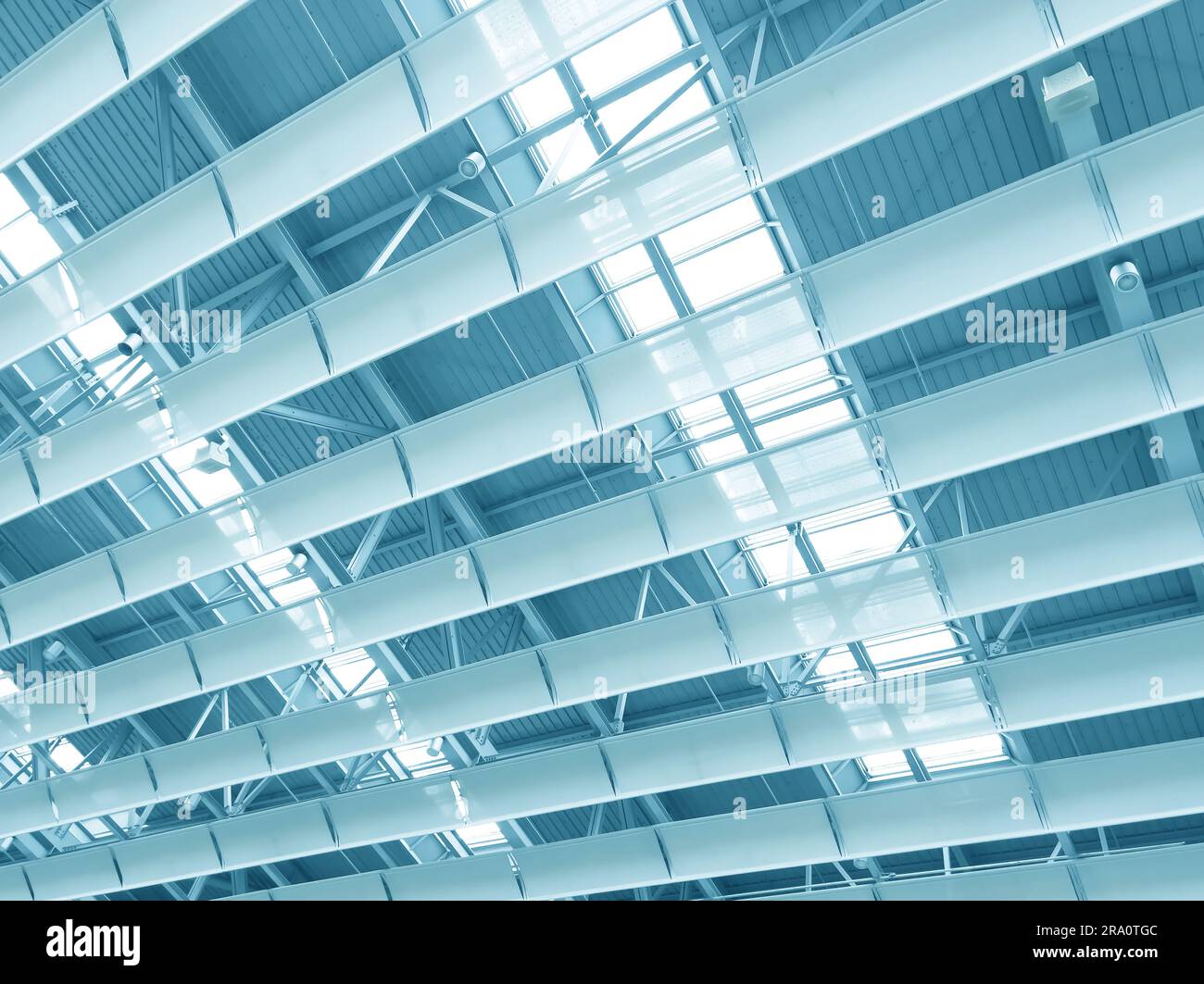 Lights and ventilation system in long line on ceiling of the industrial ...