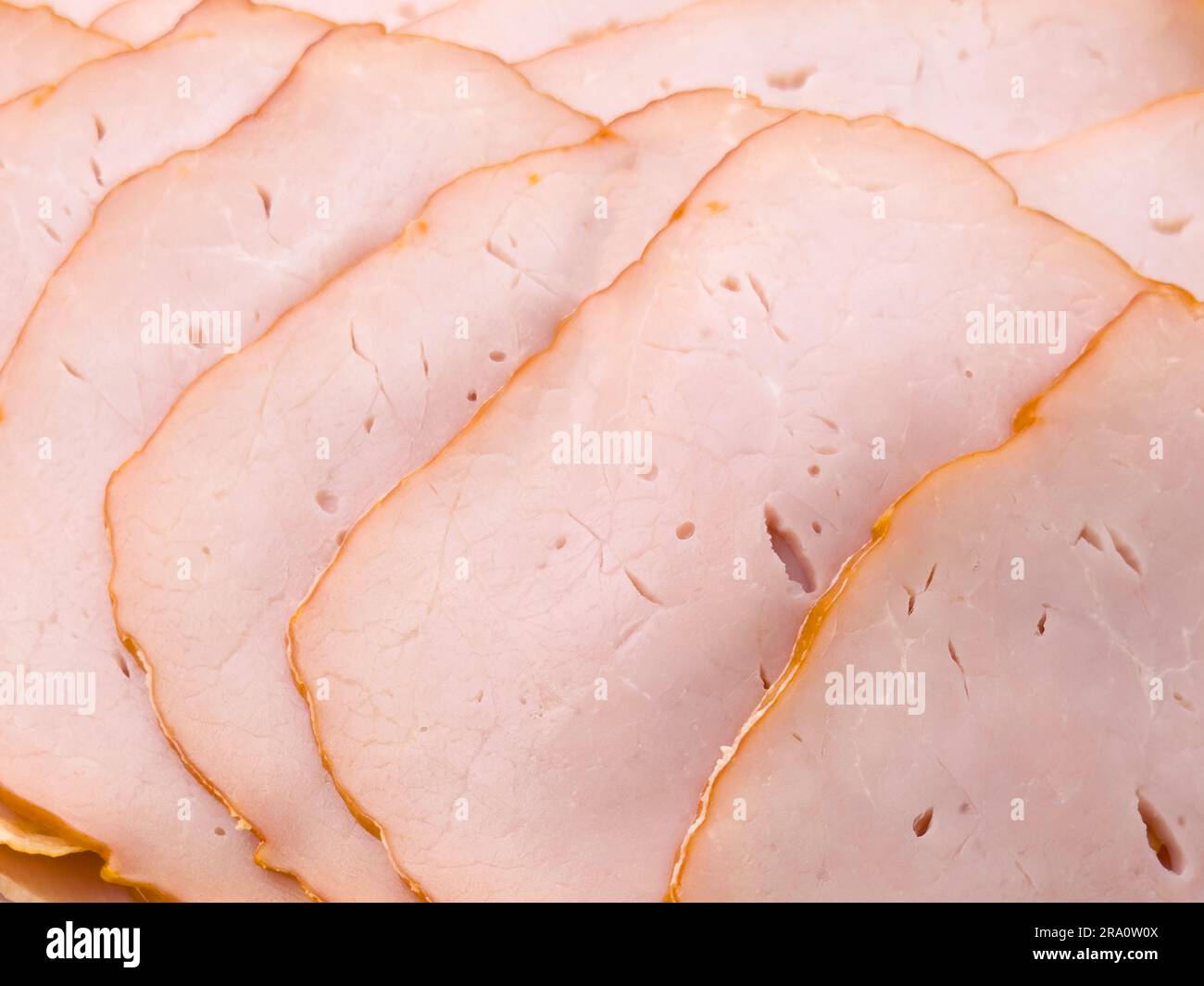 Top view of sliced smoked beef meat background. Raw beef ham isolated ...