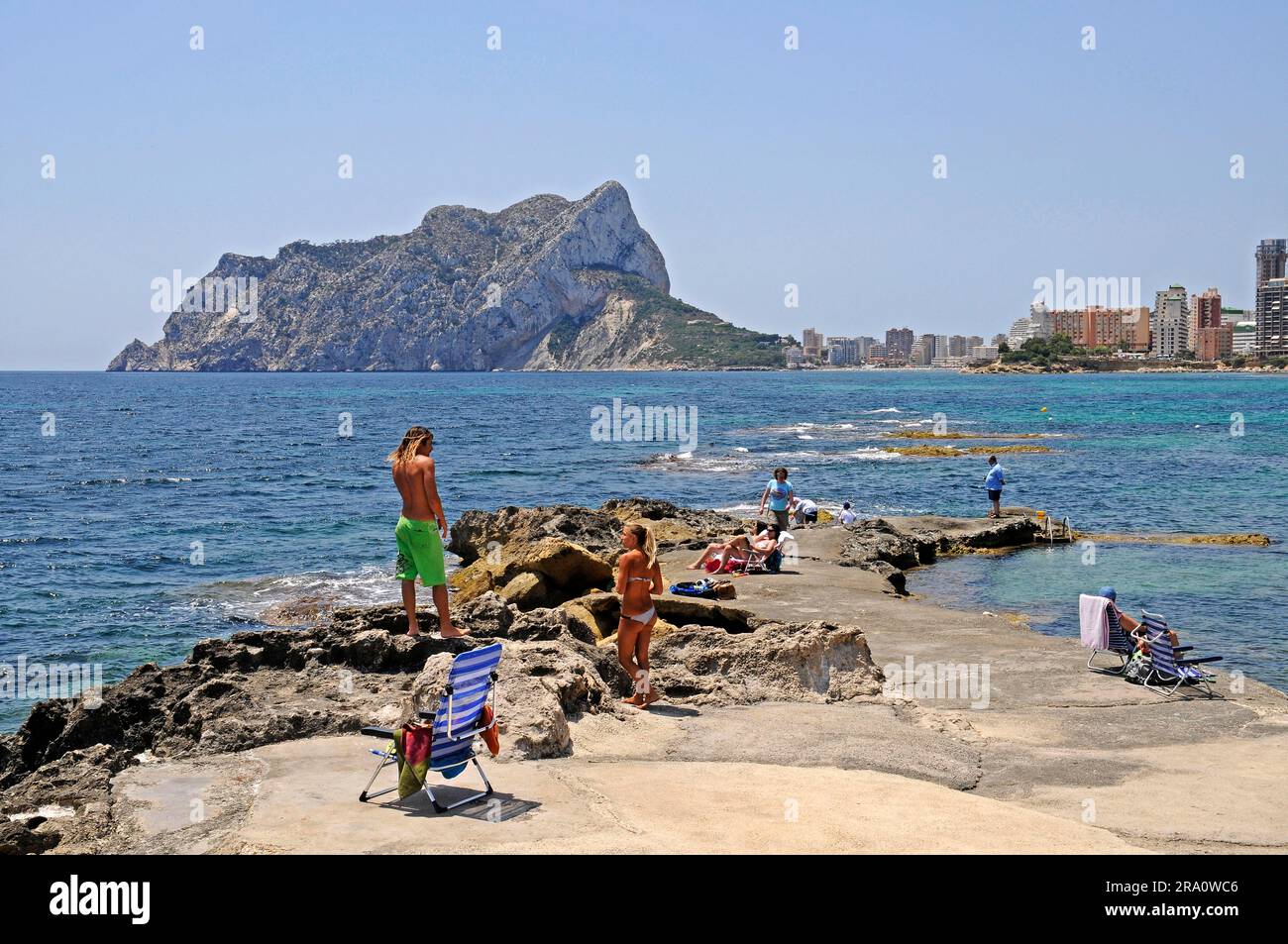 Holidaymakers at Cala Les Bassetes, Penon de Ifach Natural Park, Calp ...