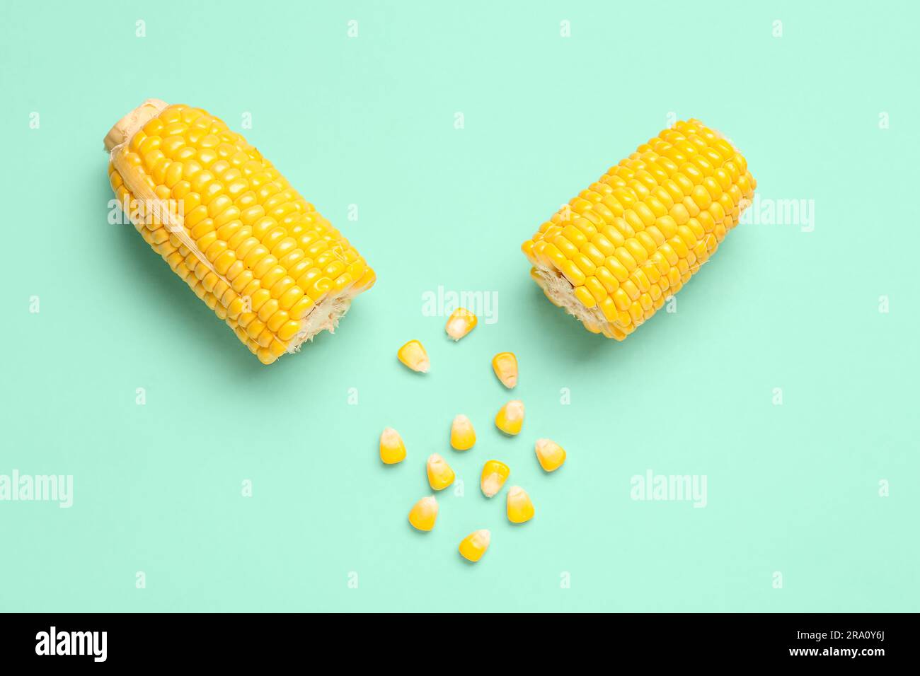 Cut fresh corn cobs and seeds on turquoise background Stock Photo - Alamy