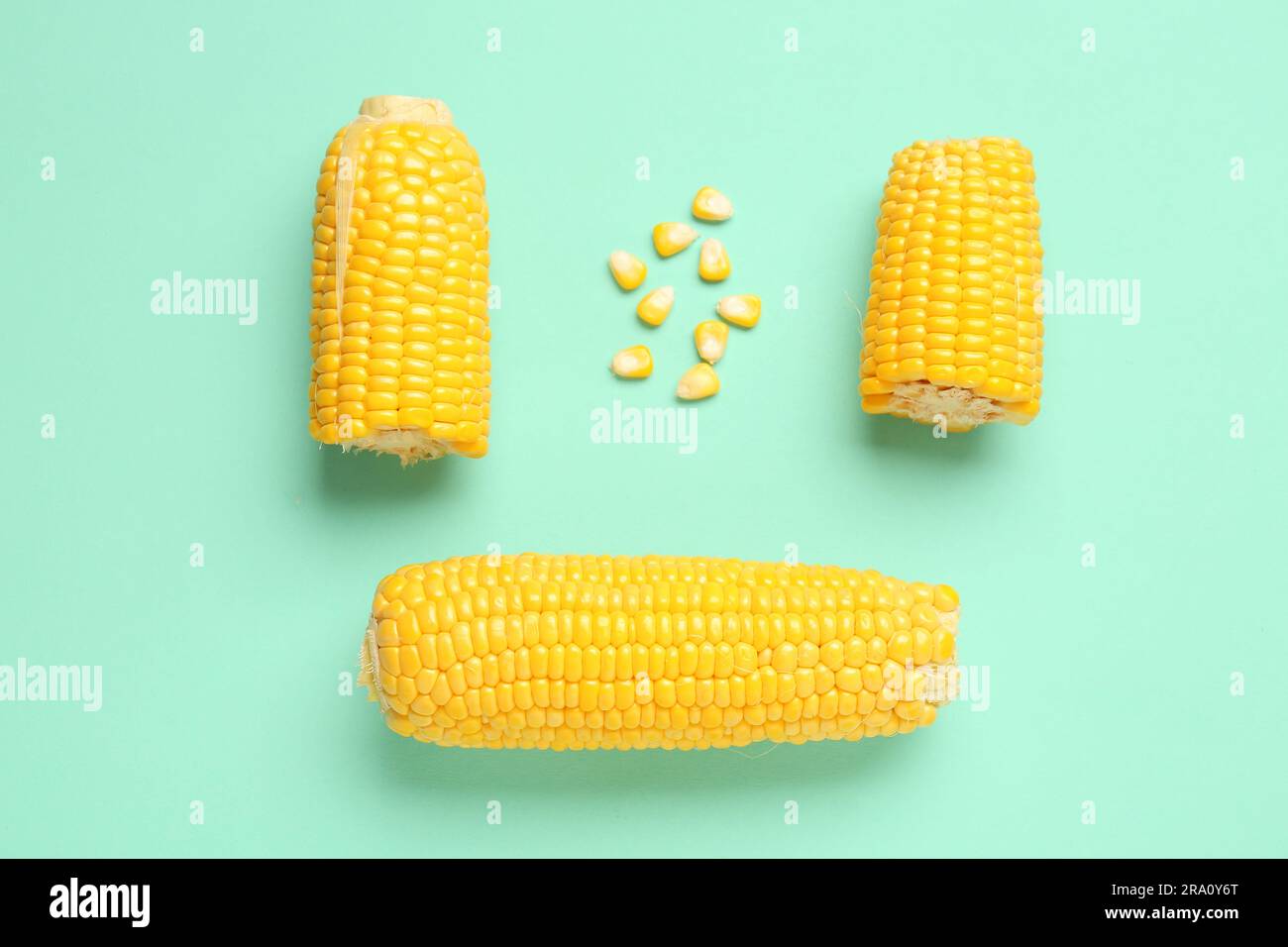 Fresh corn cobs and seeds on turquoise background Stock Photo - Alamy