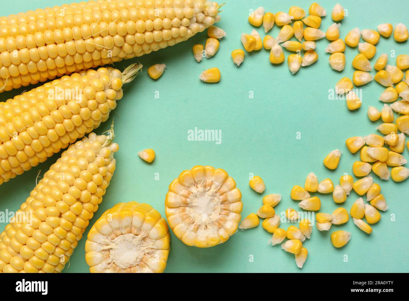 Frame made of fresh corn cobs with seeds on blue background Stock Photo ...