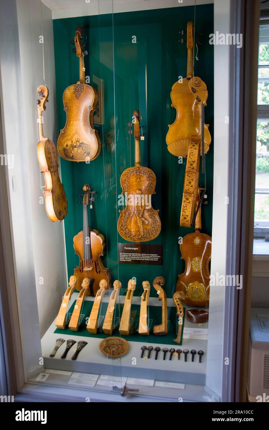 Musical instruments in showcase, instrument museum, violin, violins ...