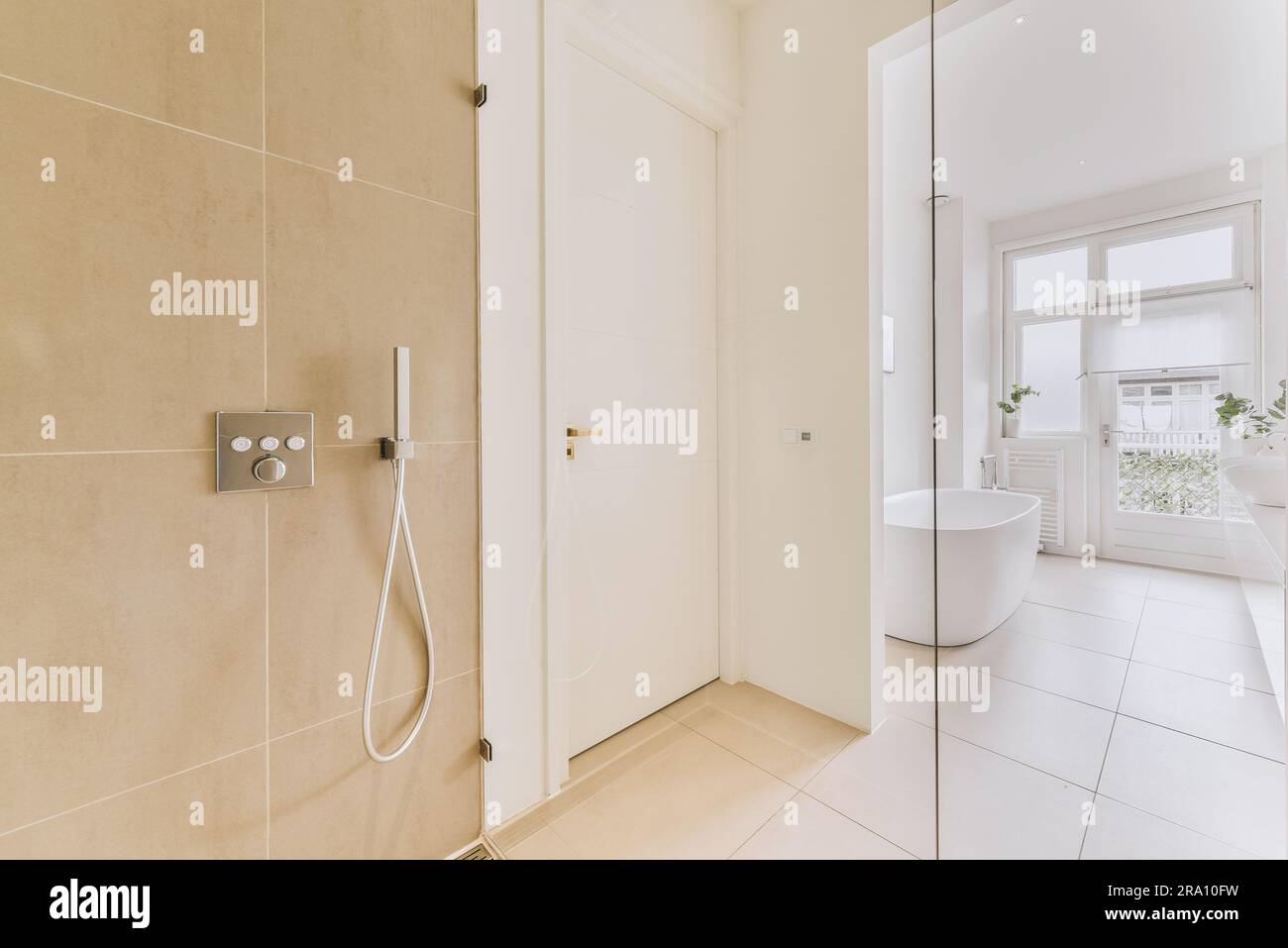 a bathroom with a shower and toilet in the corner, as seen from the ...