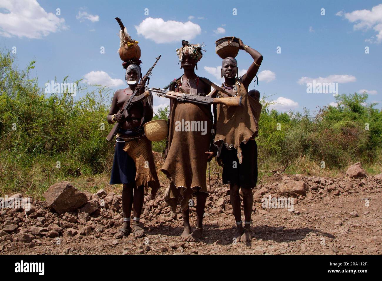 Women with Kalashnikov, lip disc, Mursi tribe, Mago National Park ...