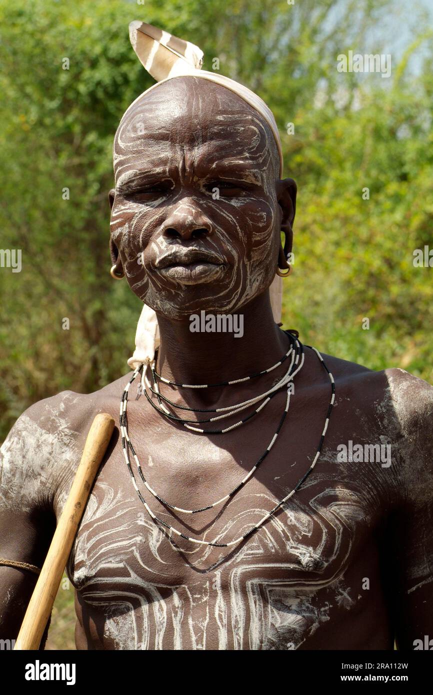 Man, Mursi tribe, body painting, Mago National Park, southern Ethiopia ...