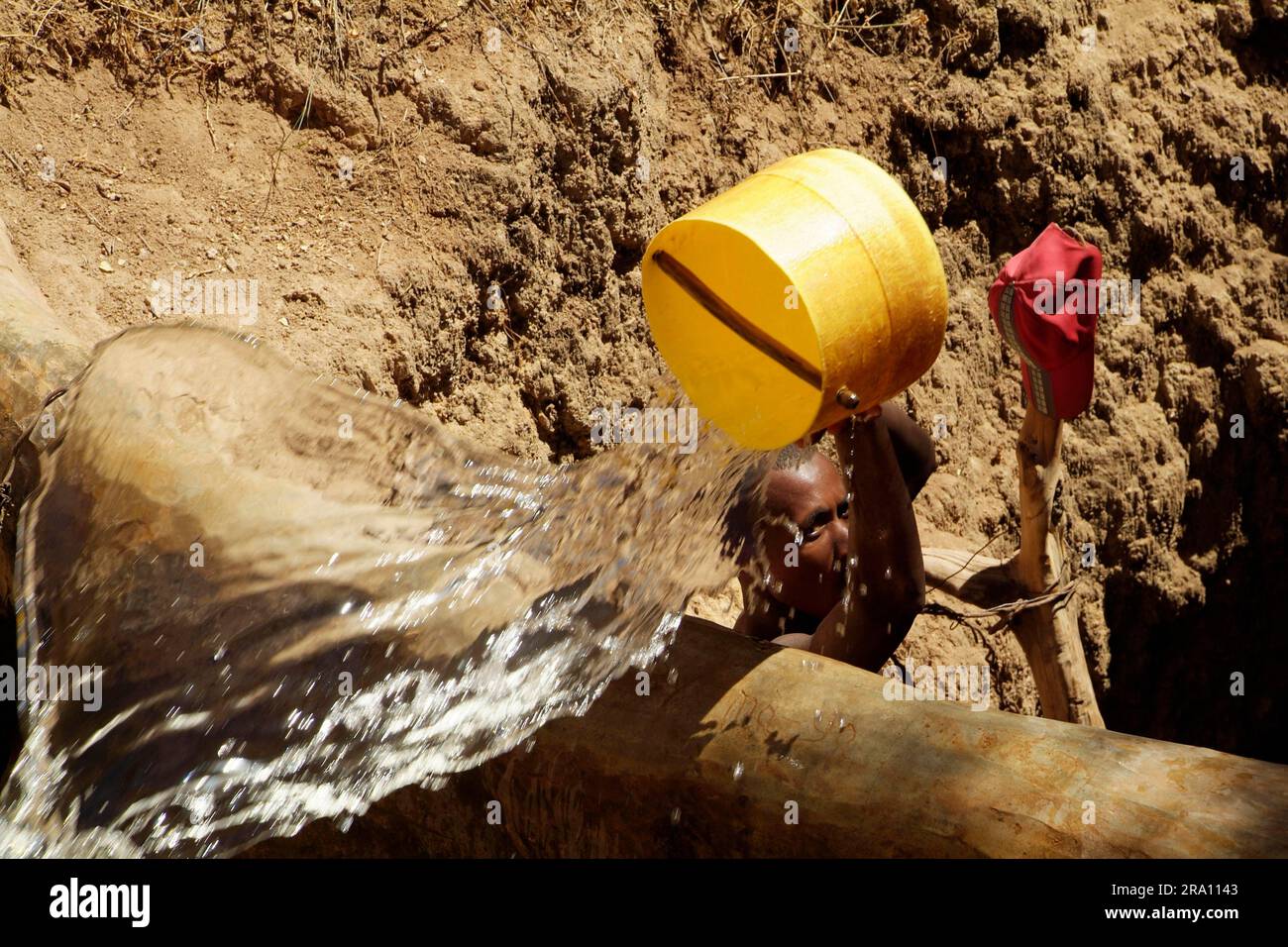 Man from Borana tribe fills singing well, near Lubluq, southern ...