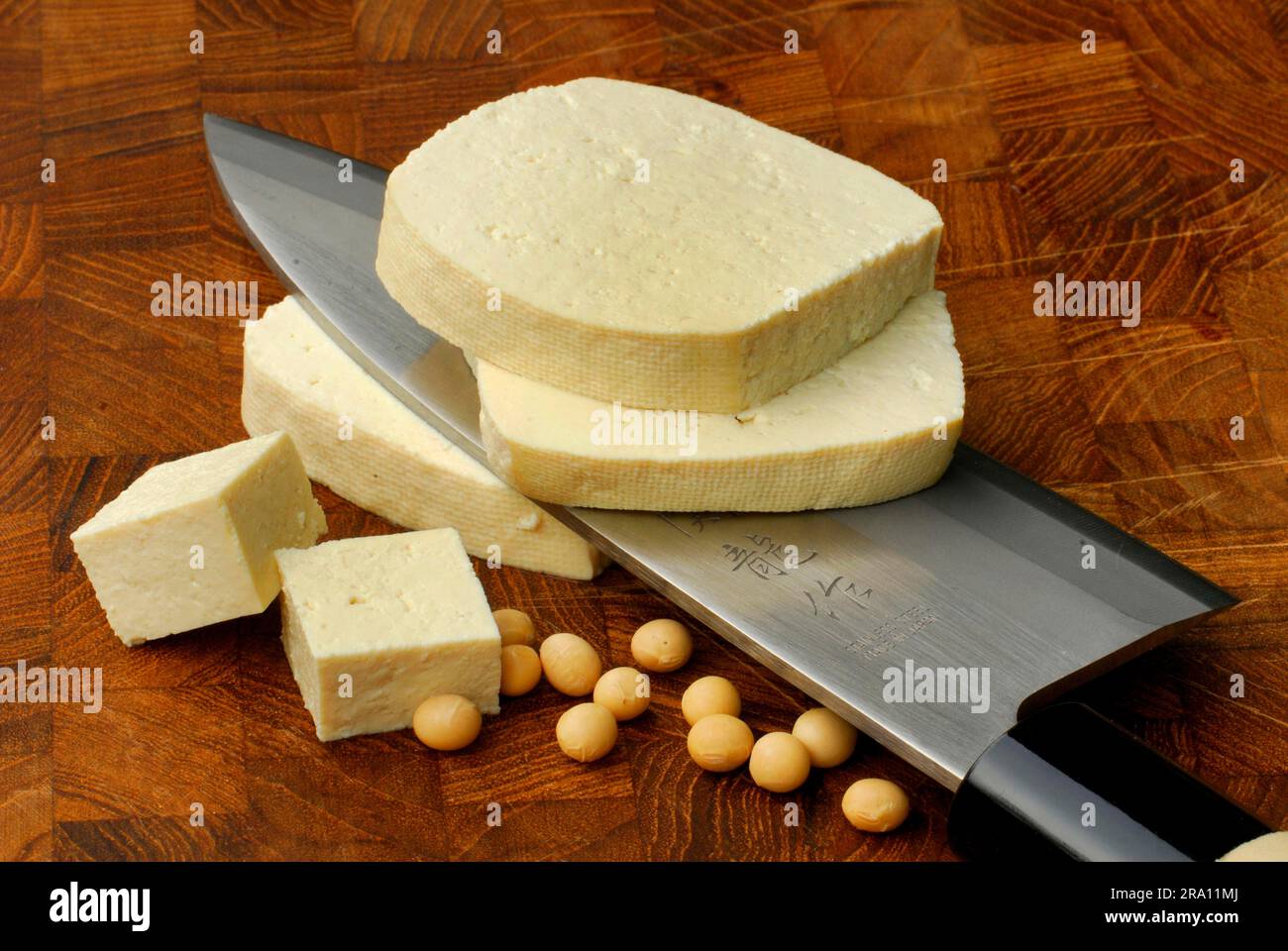 Tofu slices, knife, soy bean curd, bean curd Stock Photo - Alamy