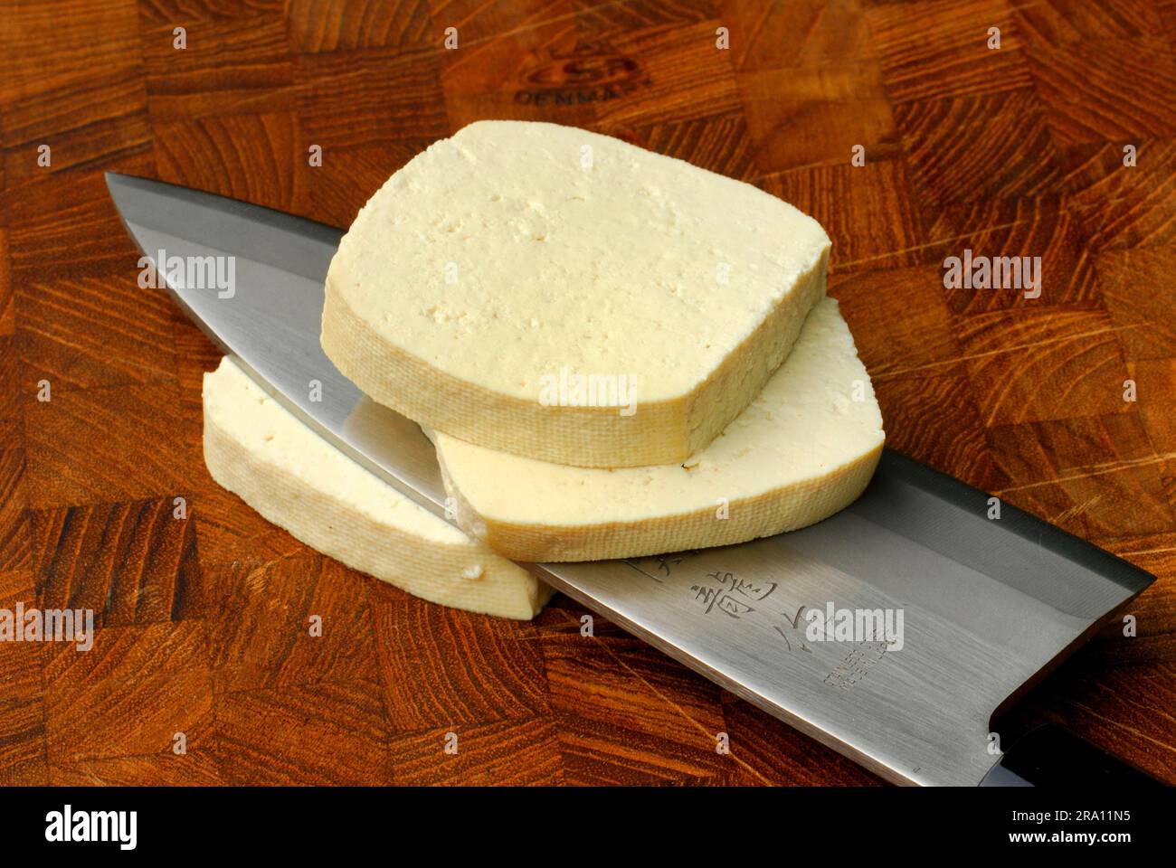 Tofu slices, knife, soy bean curd, bean curd Stock Photo - Alamy
