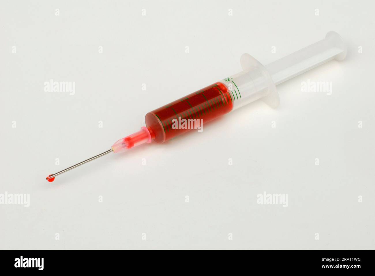 Hypodermic syringe with cannula and red liquid, cut-out, object ... Hypodermic syringe with cannula and red liquid, cut-out, object ...