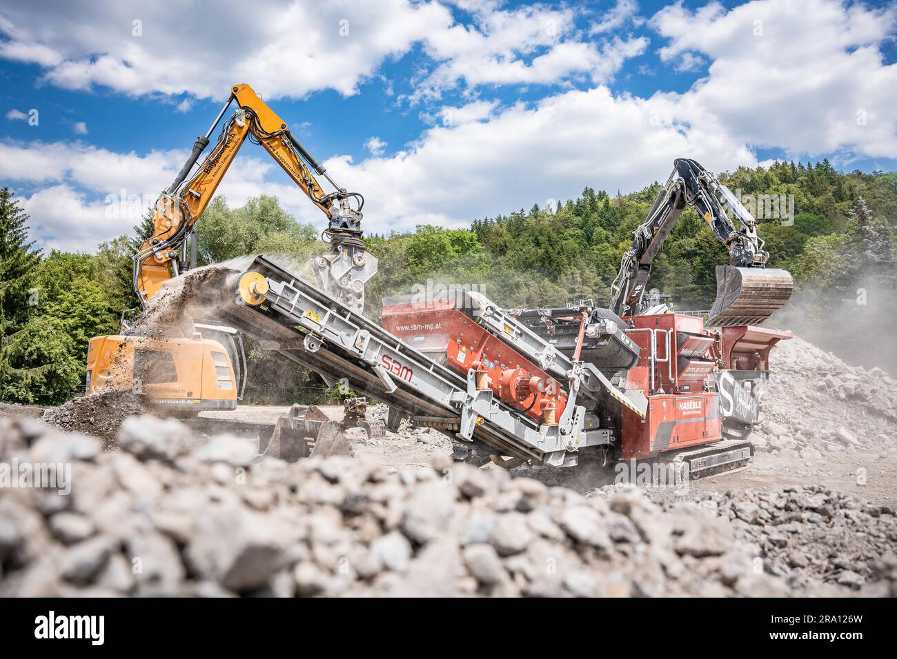 Demolition site with recycling plant and excavator Stock Photo - Alamy