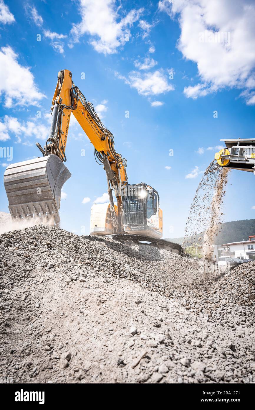Demolition site with recycling plant and excavator Stock Photo - Alamy