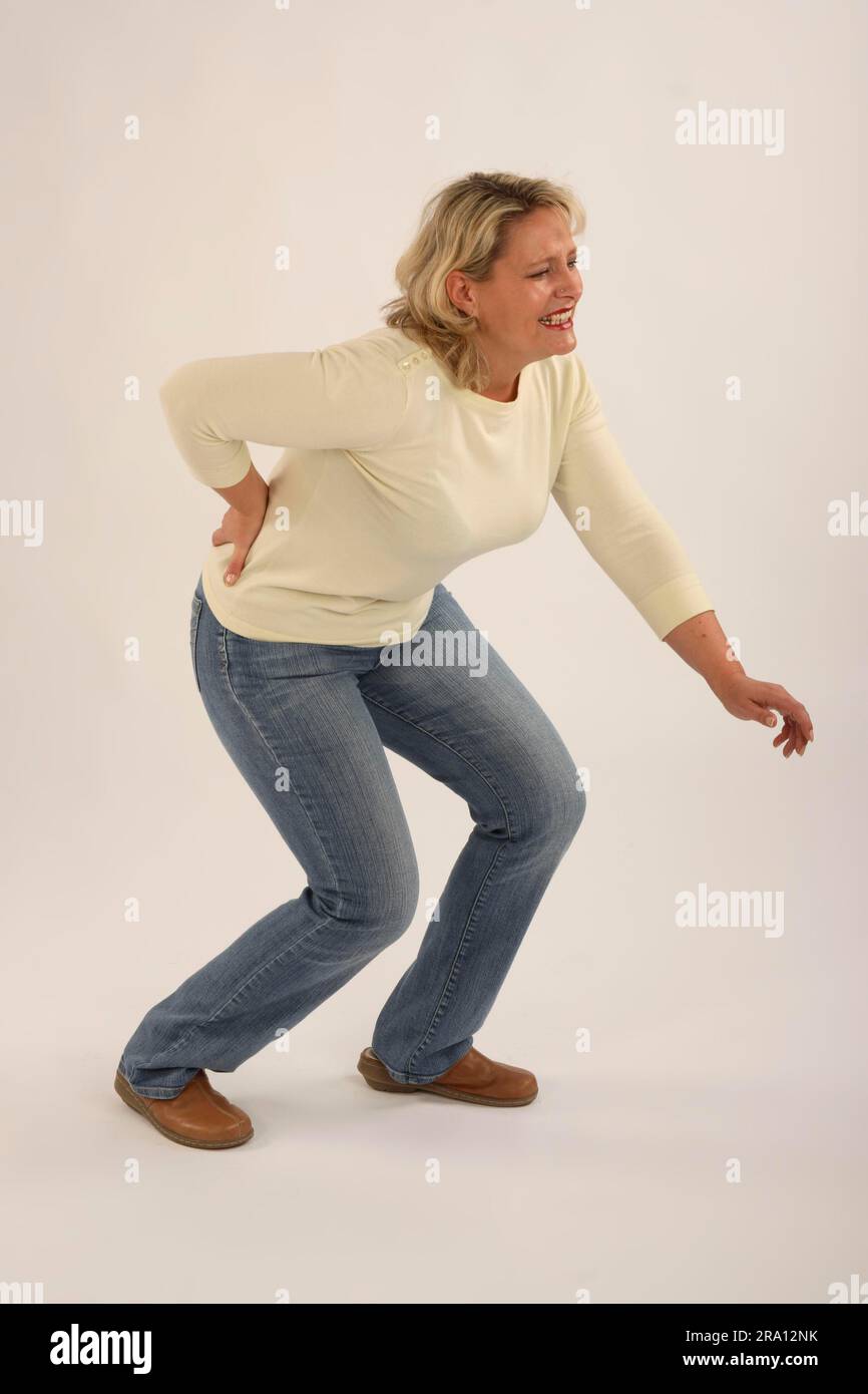 Woman with back pain, free-standing, object, lumbago Stock Photo - Alamy