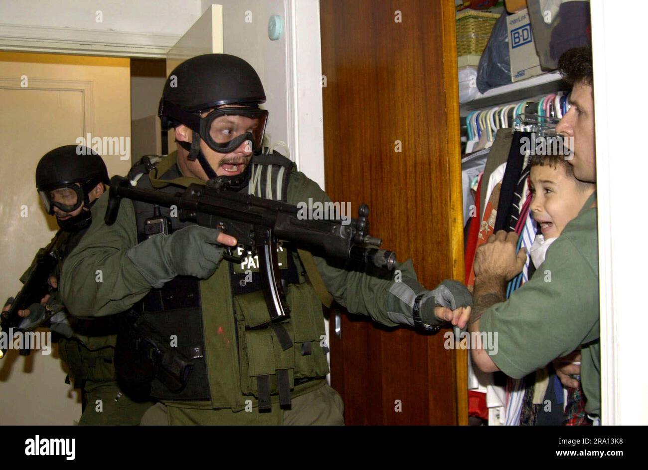 FILE - Elian Gonzalez is held in a closet by Donato Dalrymple, one of ...