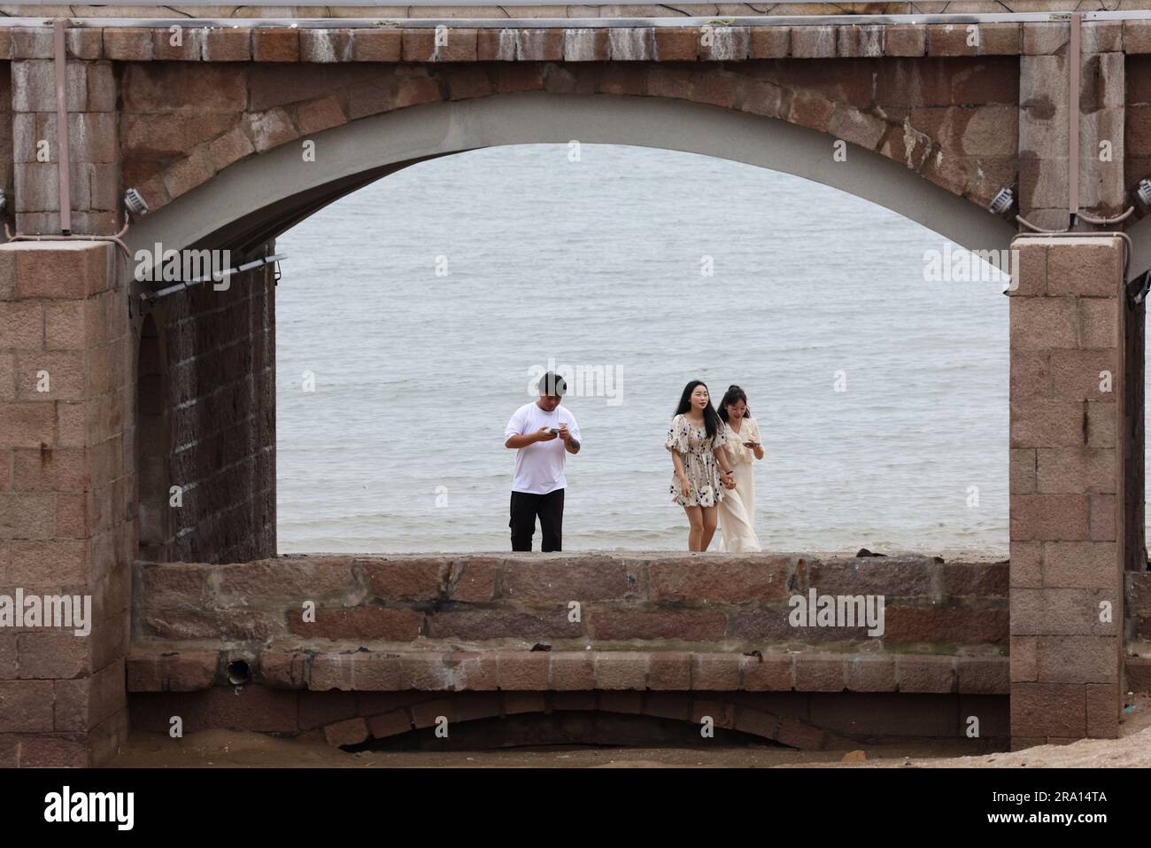 FUZHOU, CHINA - JUNE 23, 2023 - Tourists cool off at the beach during ...