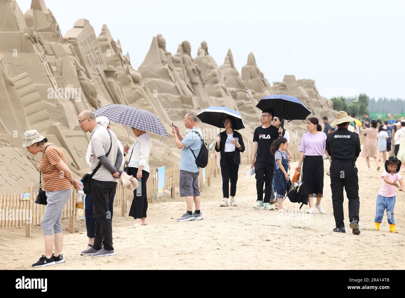 FUZHOU, CHINA - JUNE 23, 2023 - Tourists cool off at the beach during ...