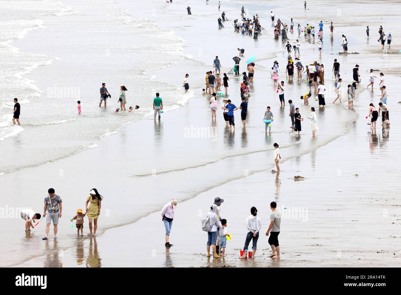 FUZHOU, CHINA - JUNE 23, 2023 - Tourists cool off at the beach during ...