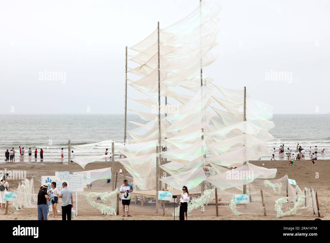 FUZHOU, CHINA - JUNE 23, 2023 - Tourists cool off at the beach during ...