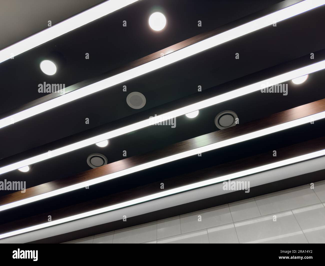 Lights and ventilation system in long line on ceiling of the industrial ...