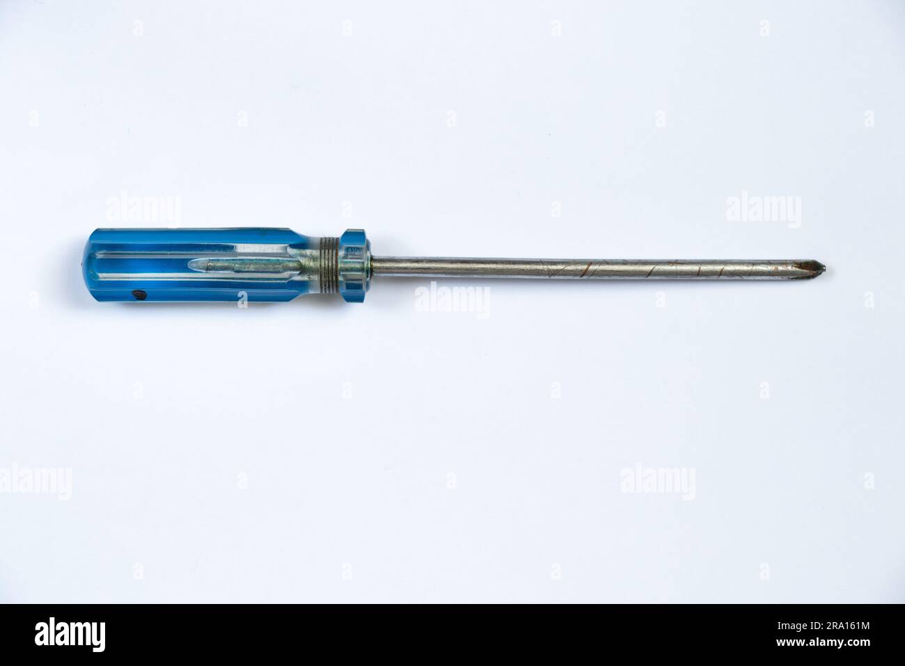 of a screwdriver with a blue handle on an isolated white background ...