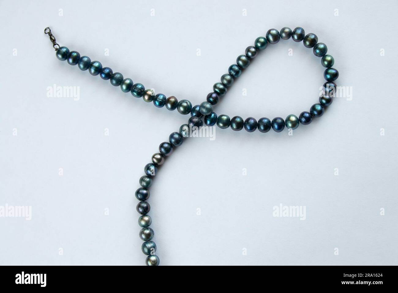 pearl female beads on an isolated background Stock Photo - Alamy