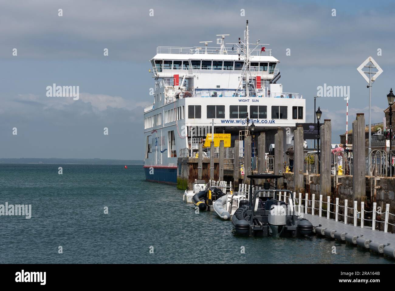 Wightlink ferry loading vehicles and passengers before taking them to ...