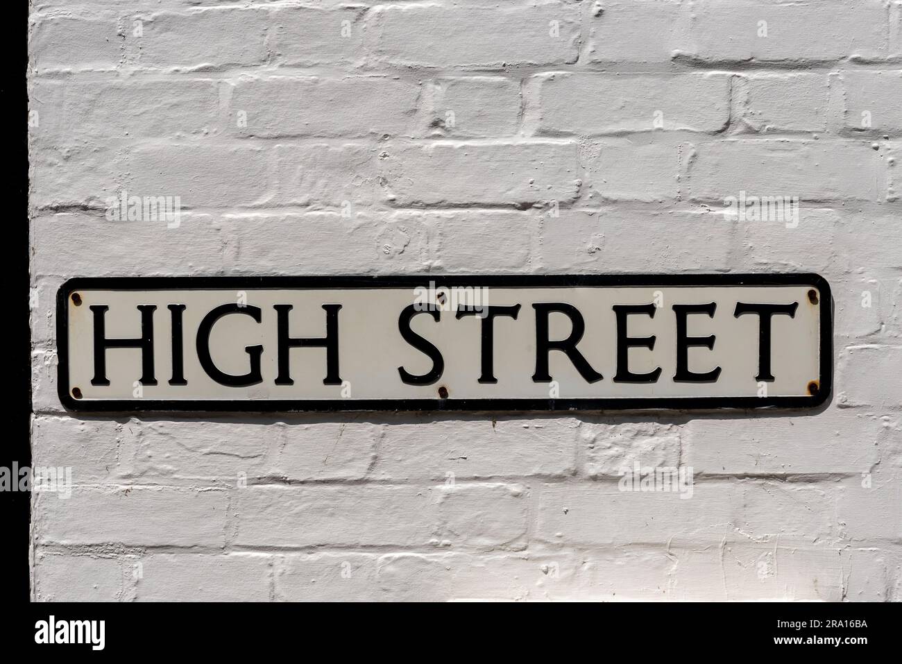 Classic high street sign on a white brick wall. Yarmouth, England, June ...