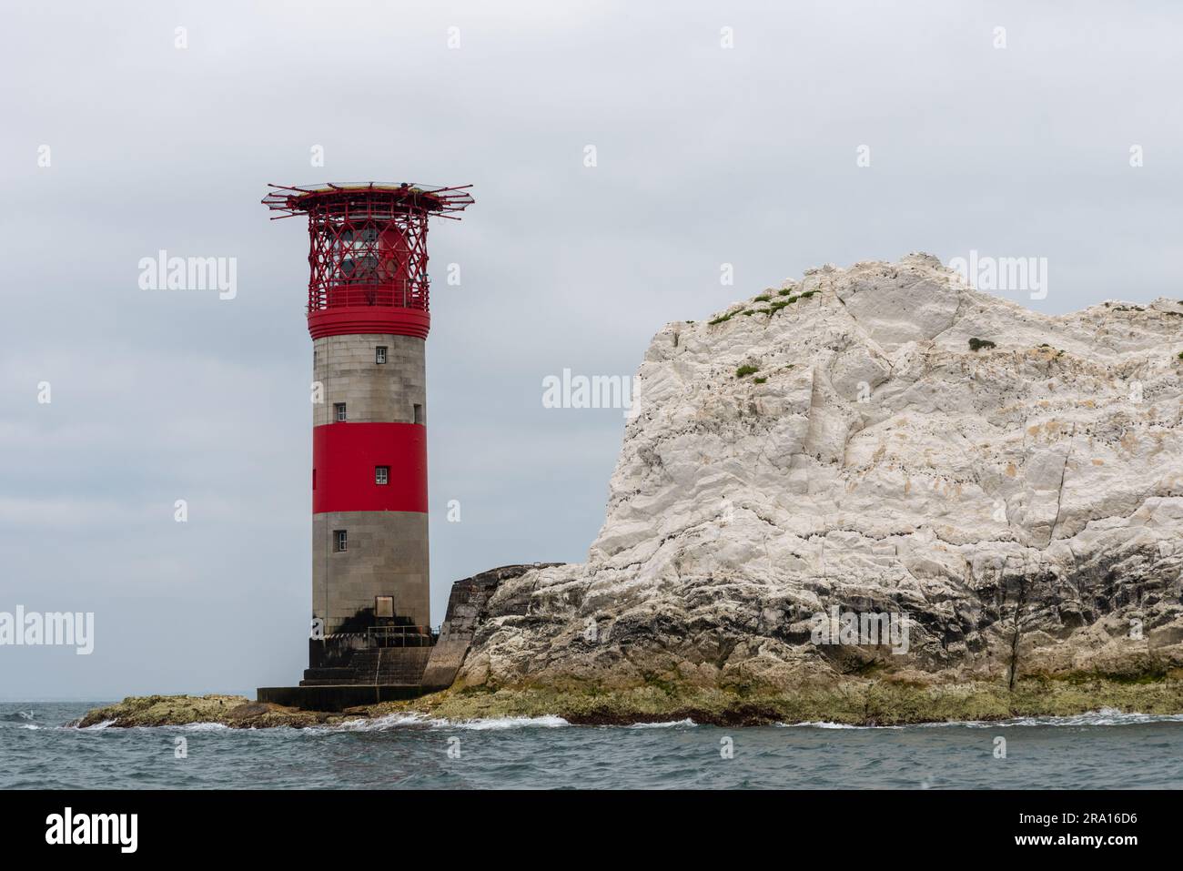 The Needles lighthouse on the Isle of Wight taken from close up passing ...