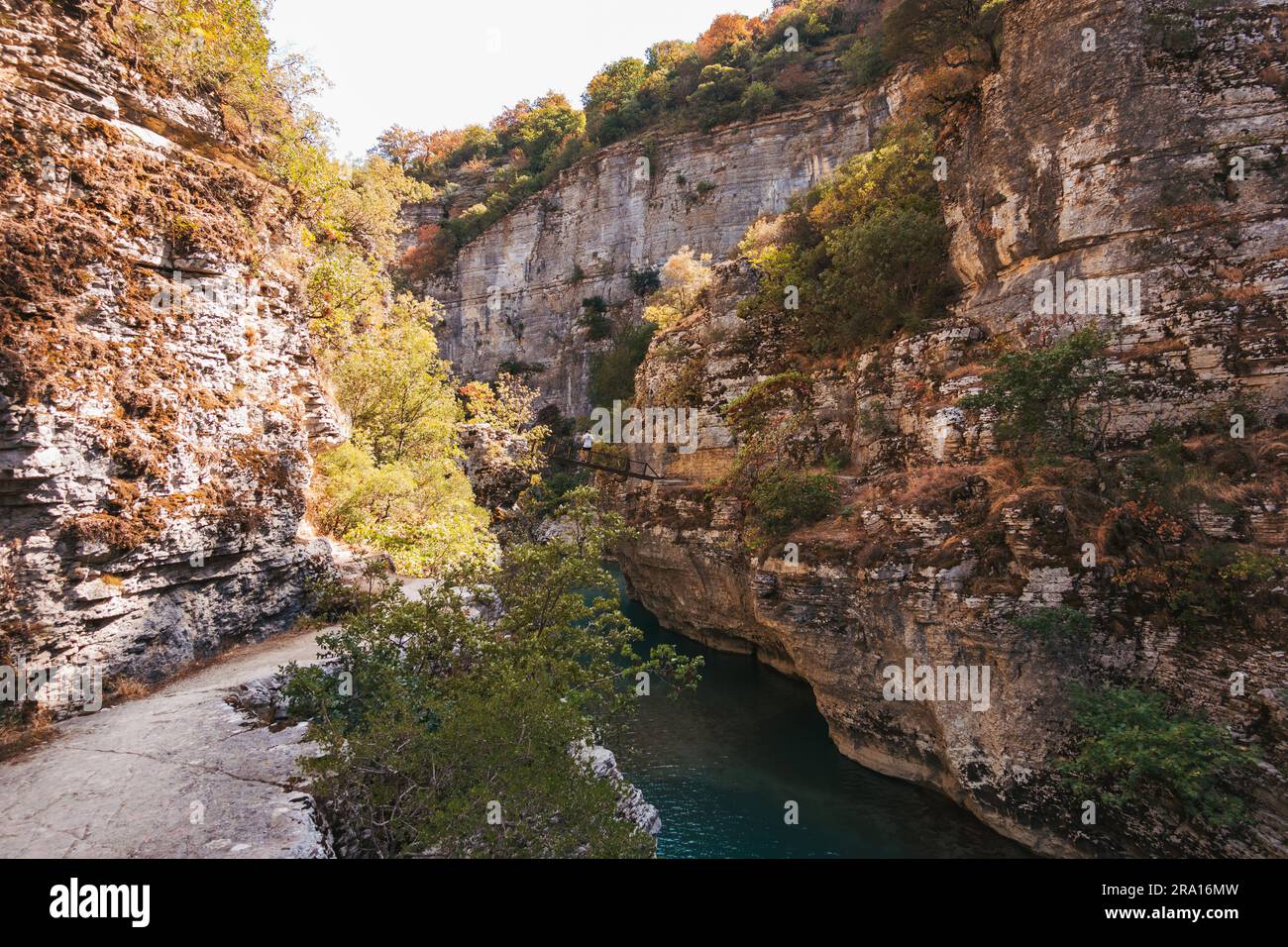 a hiking trail along a canyon wall in Osumi Canyon, Berat County ...