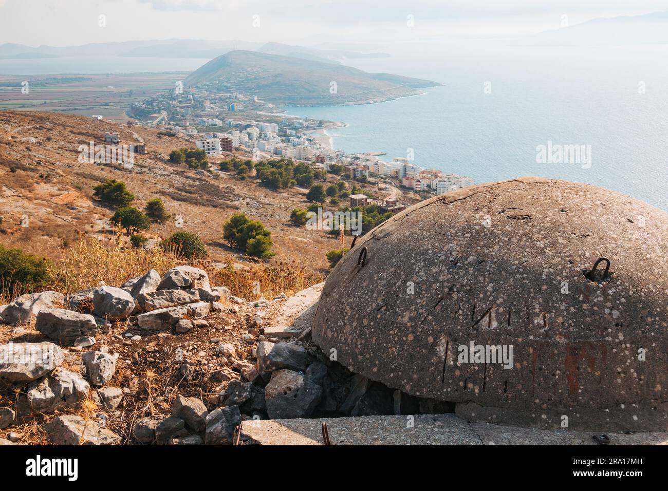 a communist era concrete bunker atop a hill in Sarandë, southern ...