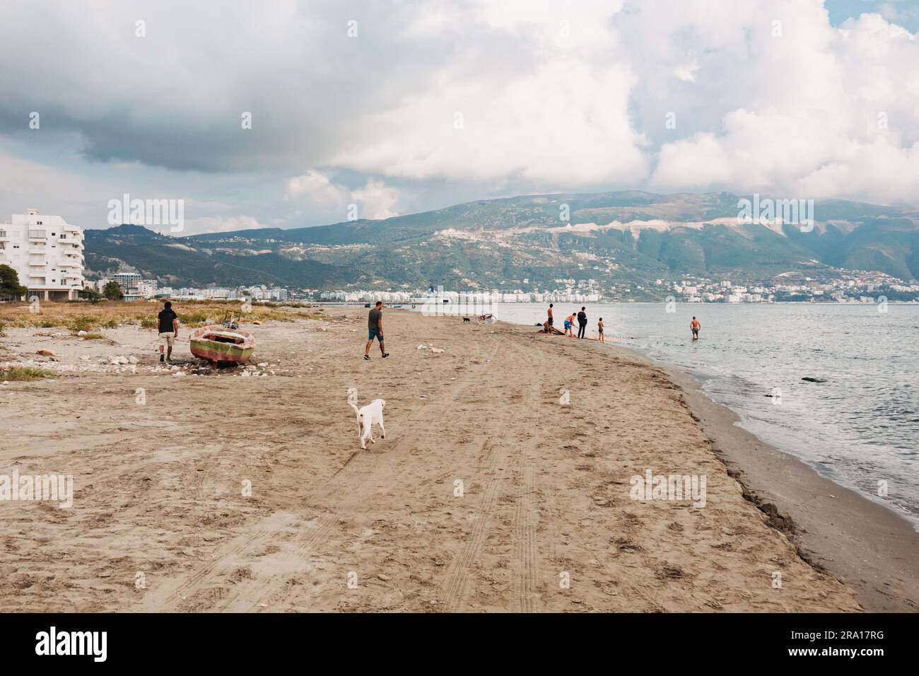 Small boats anchored at Plazhi i Vjeter (Old Beach) in the coastal city ...