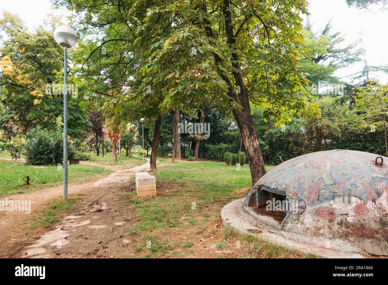 a concrete bunker in a park in Tirana, Albania. 173,000 were placed ...