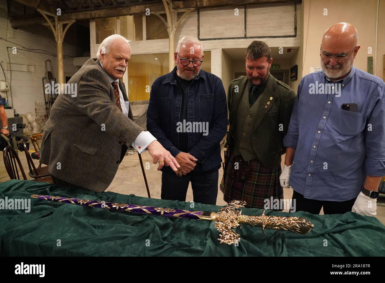 (left to right) Sword designer Mark Dennis with his team Alan Herriot ...