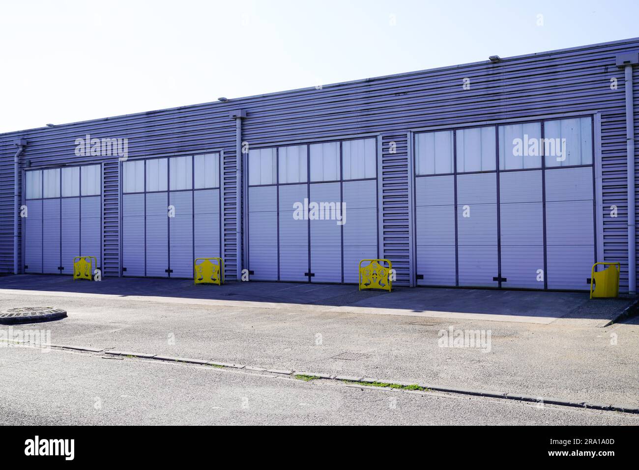 Exterior of modern distribution center warehouse grey door facade Stock ...