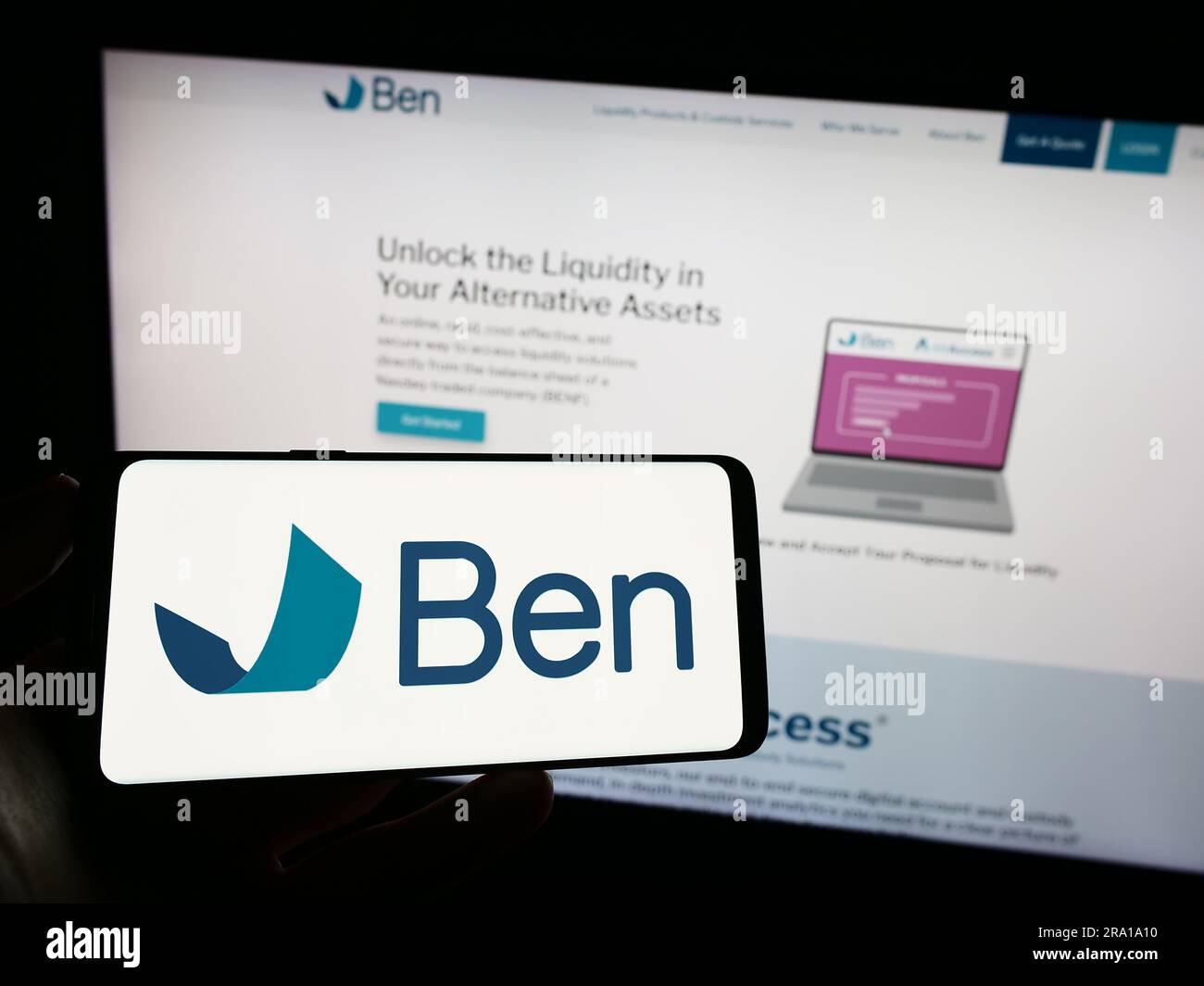 Person holding mobile phone with logo of The Beneficient Company Group ...