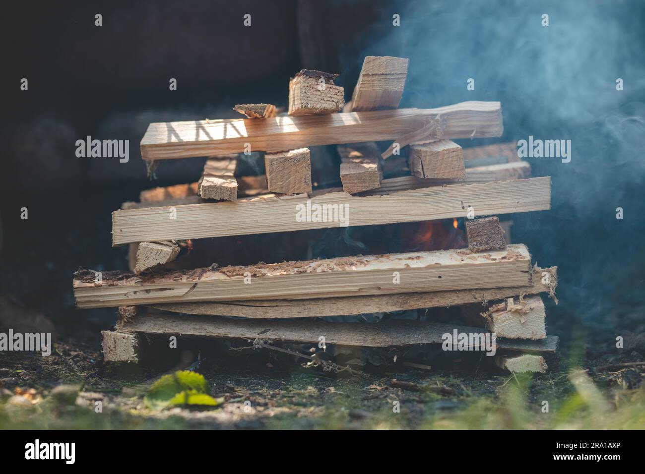 Making a fire using paper and small wood chips stacked in pyramid ... Making a fire using paper and small wood chips stacked in pyramid ...