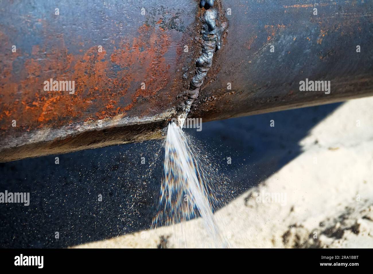 The water broke through an iron water pipe (busted water main). Lack of ...
