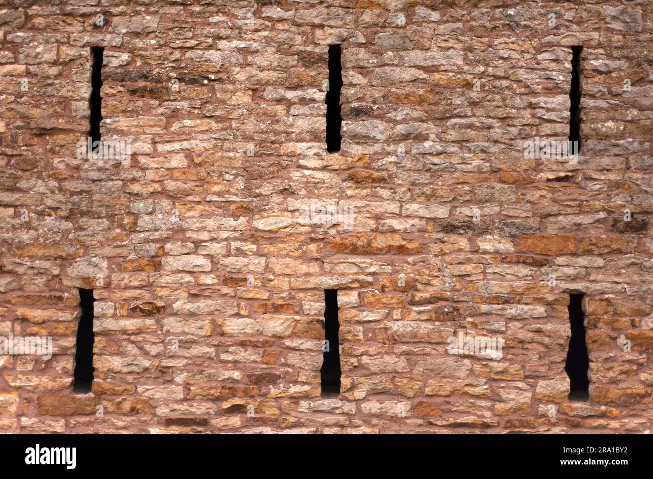 Arrow slits in stone wall Stock Photo - Alamy