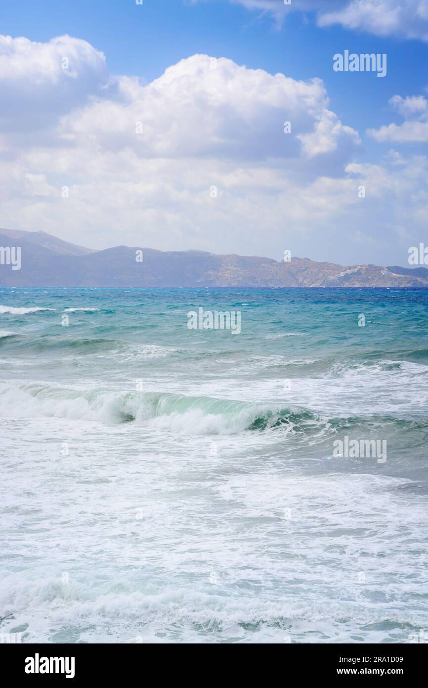 Sea view with wave, hills in the distance and cloudy sky in Crete in ...
